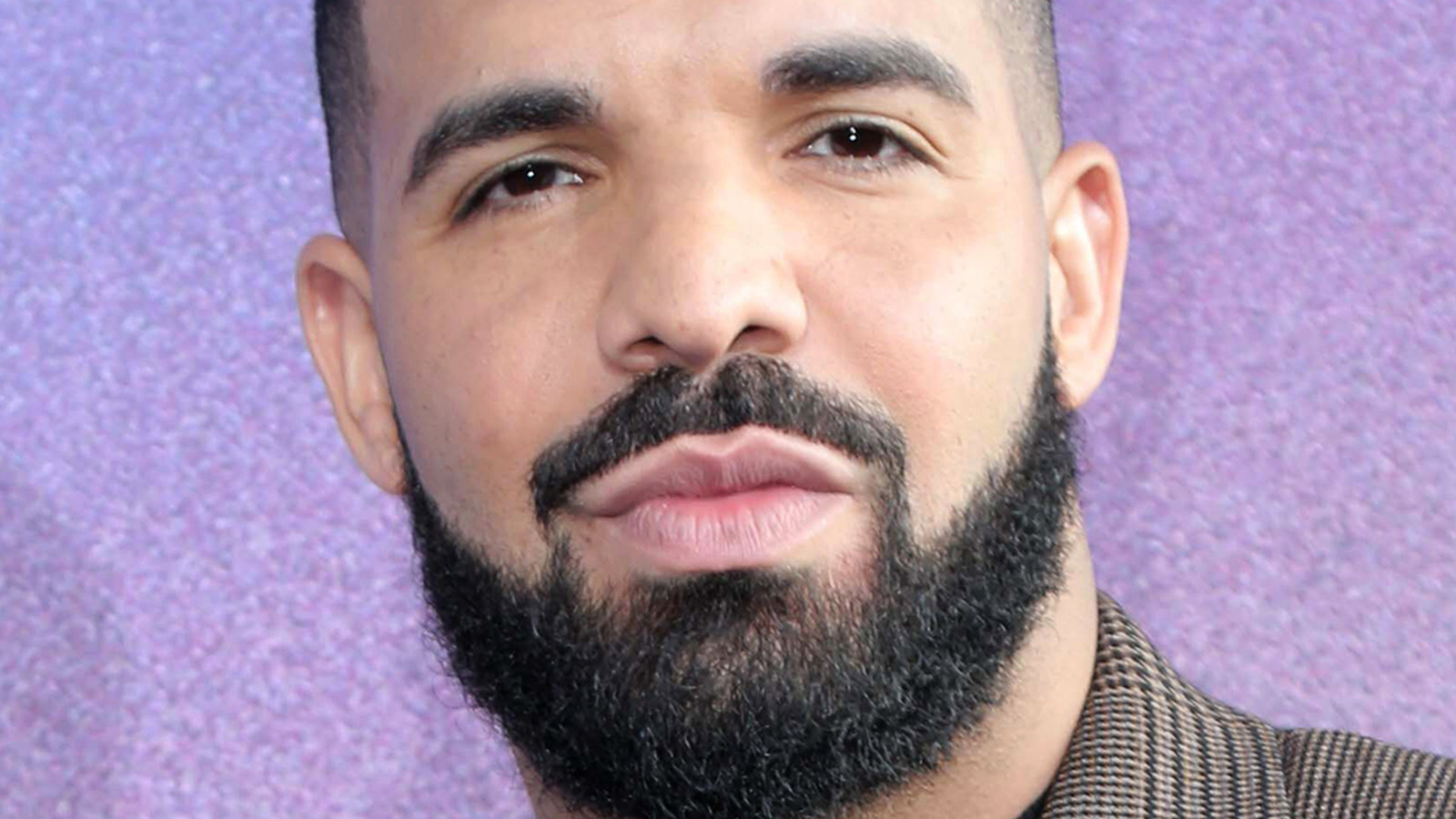 Drake Lands In Unlikely Drama After Shading Self-Portrait Tattoo